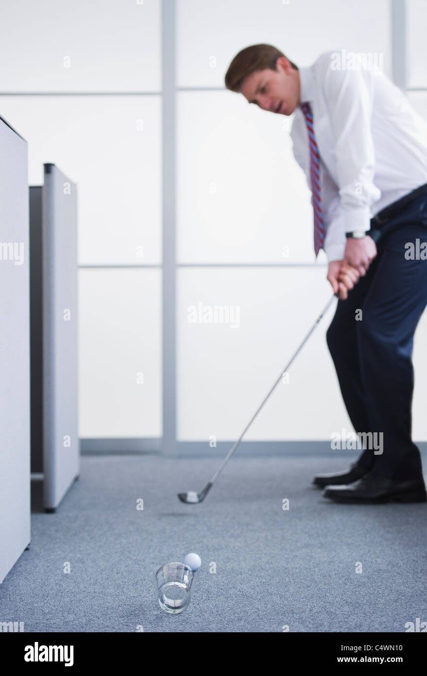 Playing golf at office hi-res stock photography and images - Alamy