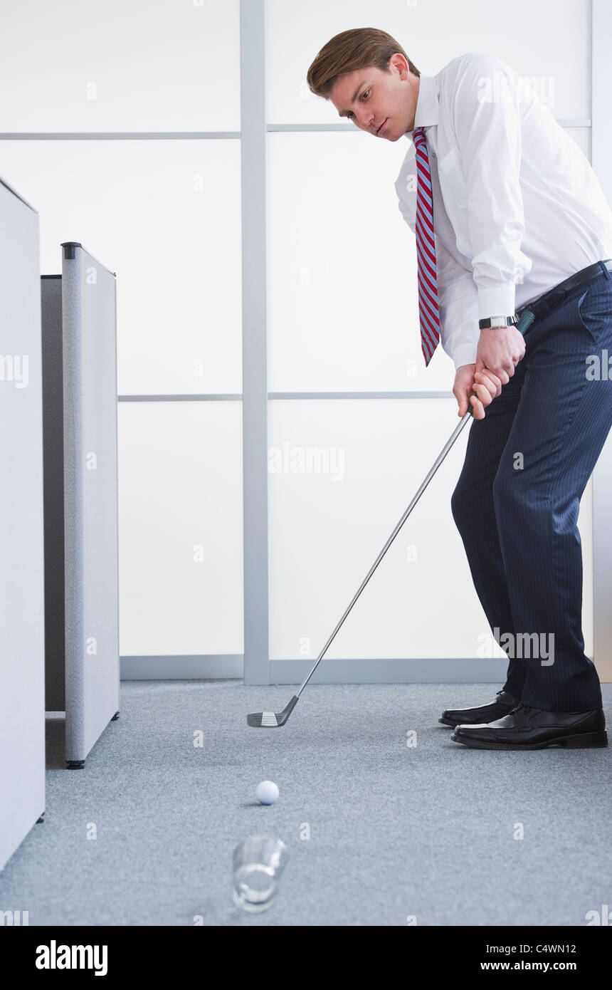 Playing golf at office hi-res stock photography and images - Alamy