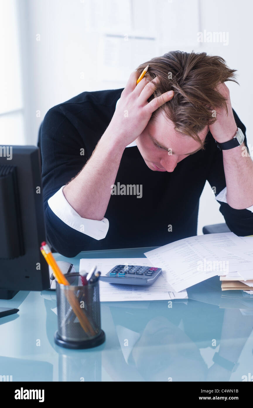 Person doing calculations calculator hi-res stock photography and ...