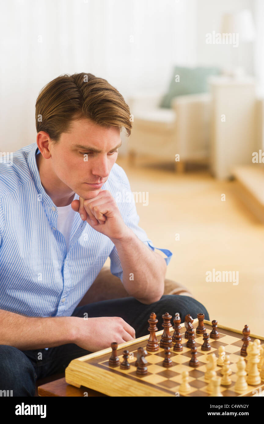 Three playing chess hi-res stock photography and images - Alamy