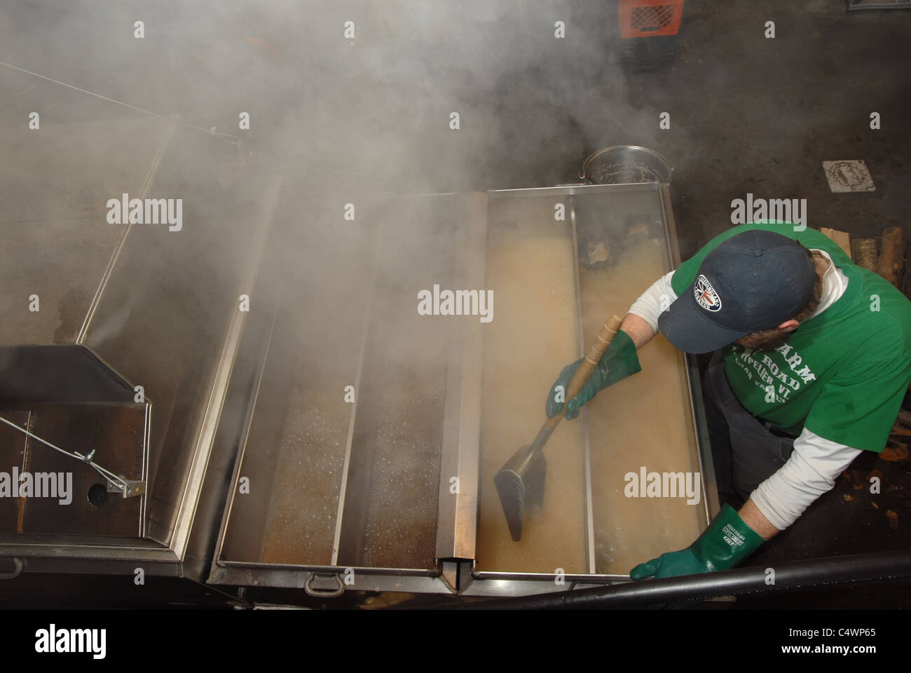 A sugar makes boils sap to make maple syrup in Vermont Stock Photo - Alamy