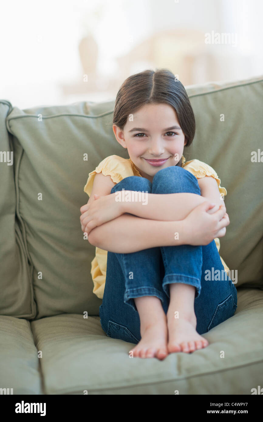 USA,New Jersey,Jersey City,portrait of girl (8-9) sitting on sofa Stock ...