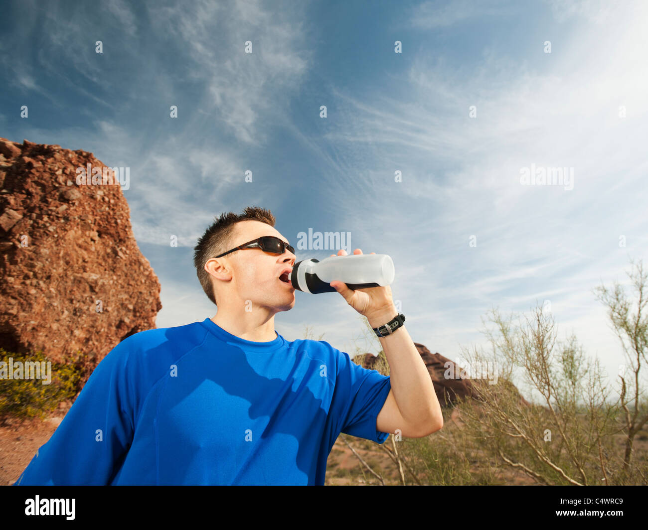 Person drinking from flask and desert hi-res stock photography and ...
