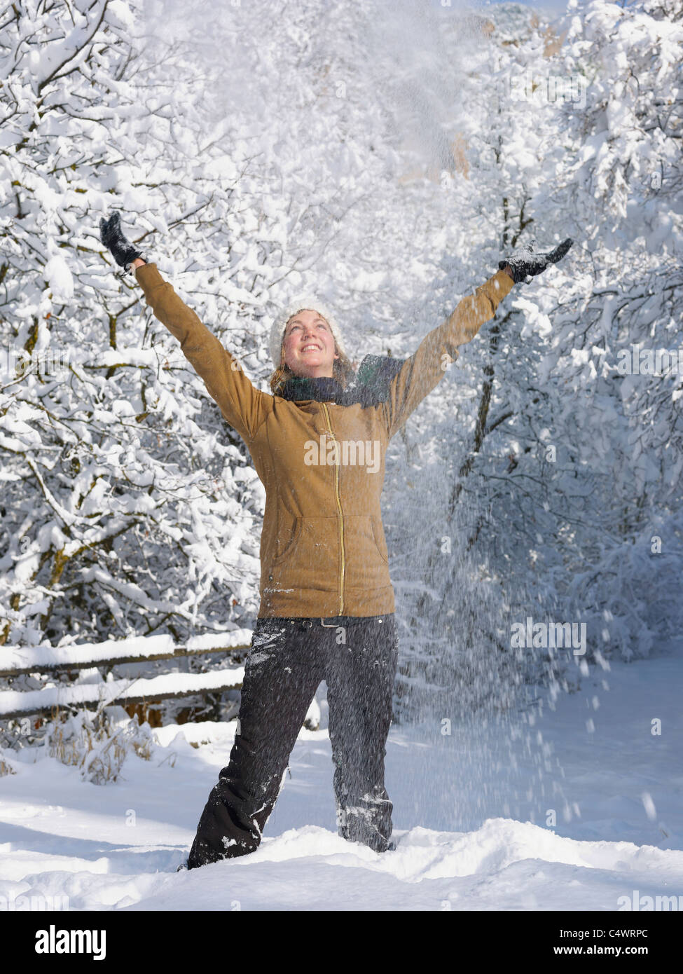 USA,Colorado,young woman throwing snow in air Stock Photo - Alamy