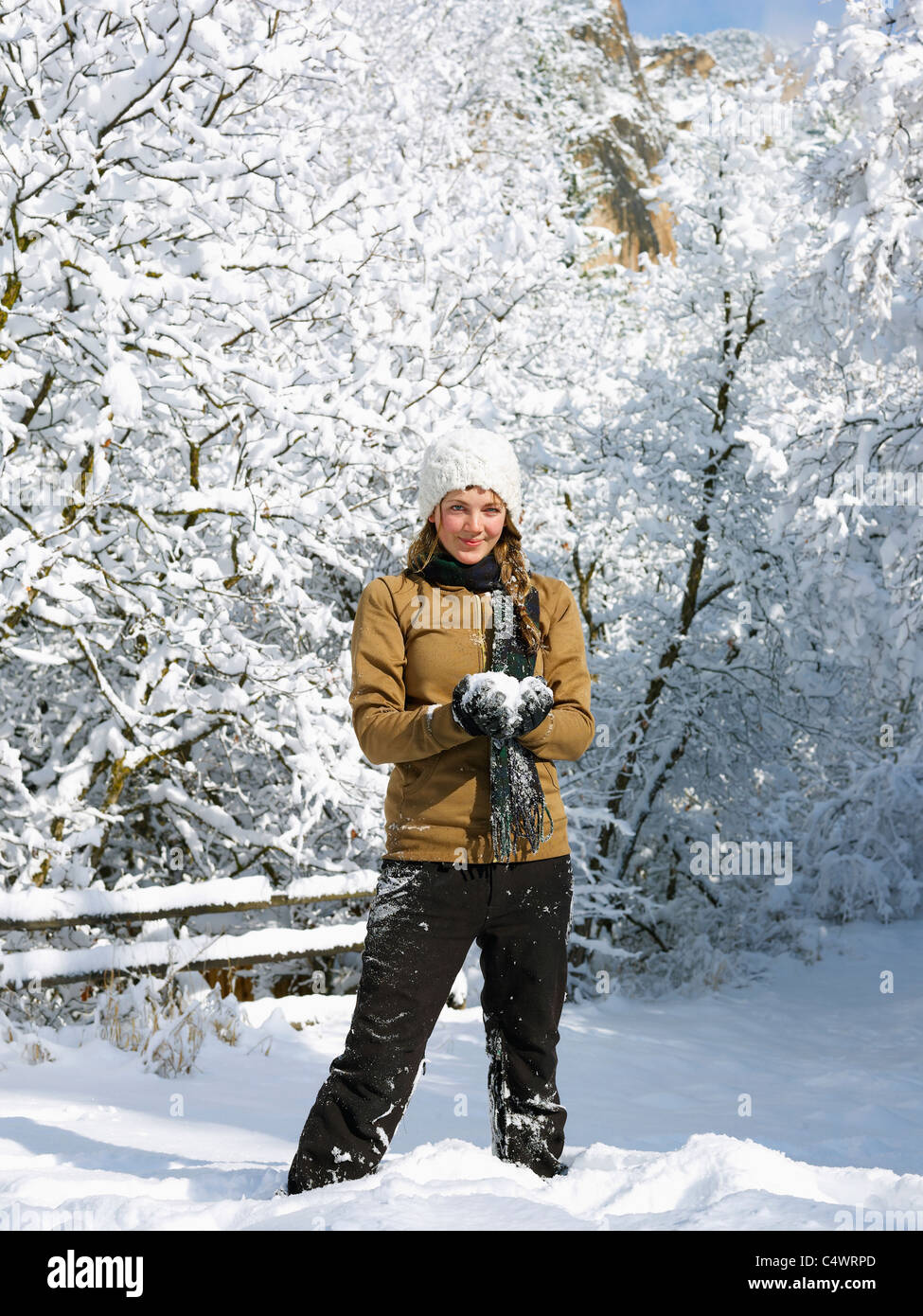USA,Colorado,portrait of young woman making snowball Stock Photo - Alamy