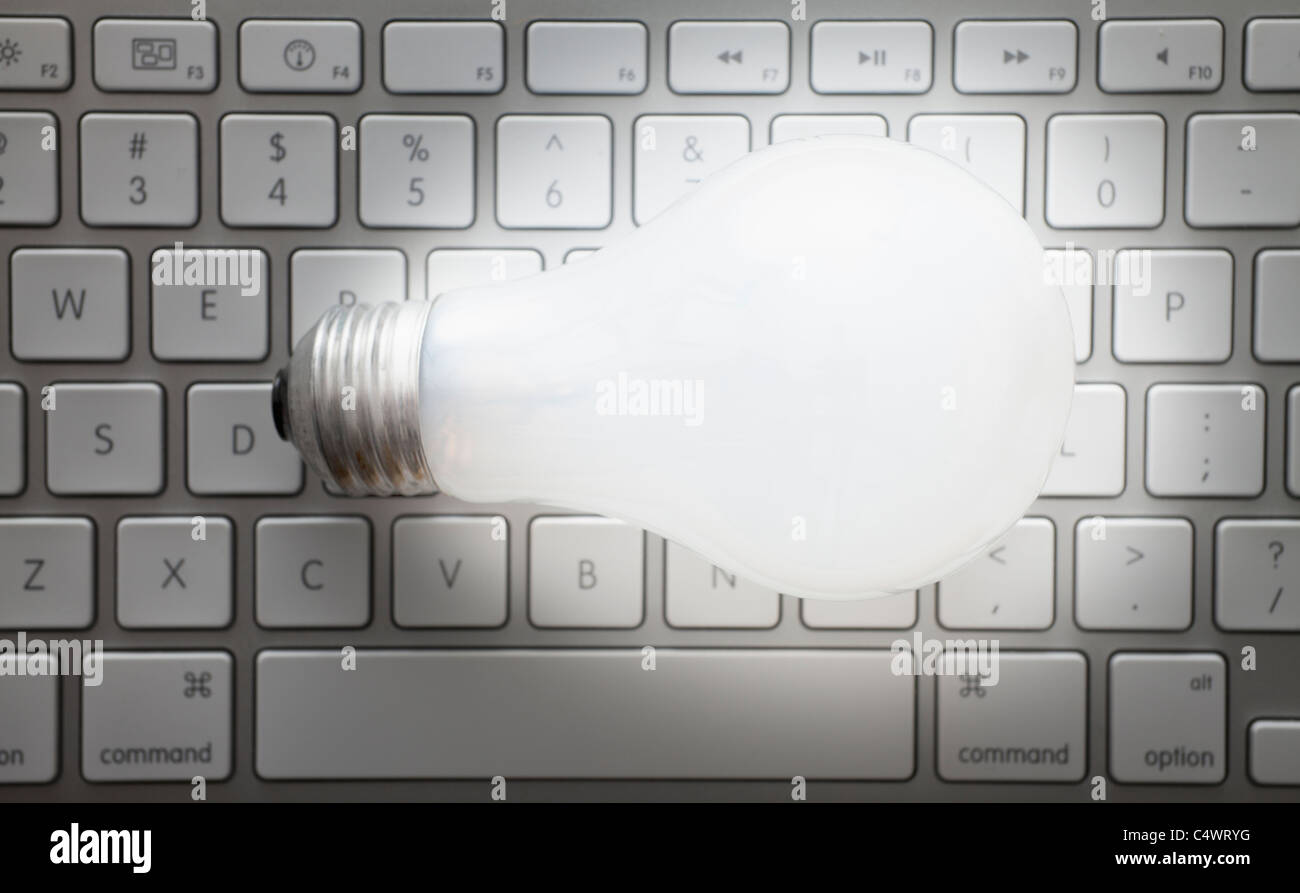 Light bulb on keyboard Stock Photo - Alamy