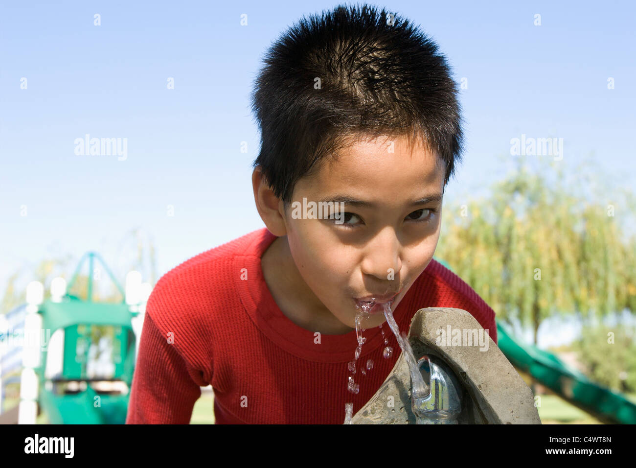 Boy drinking water fountain hi-res stock photography and images - Alamy