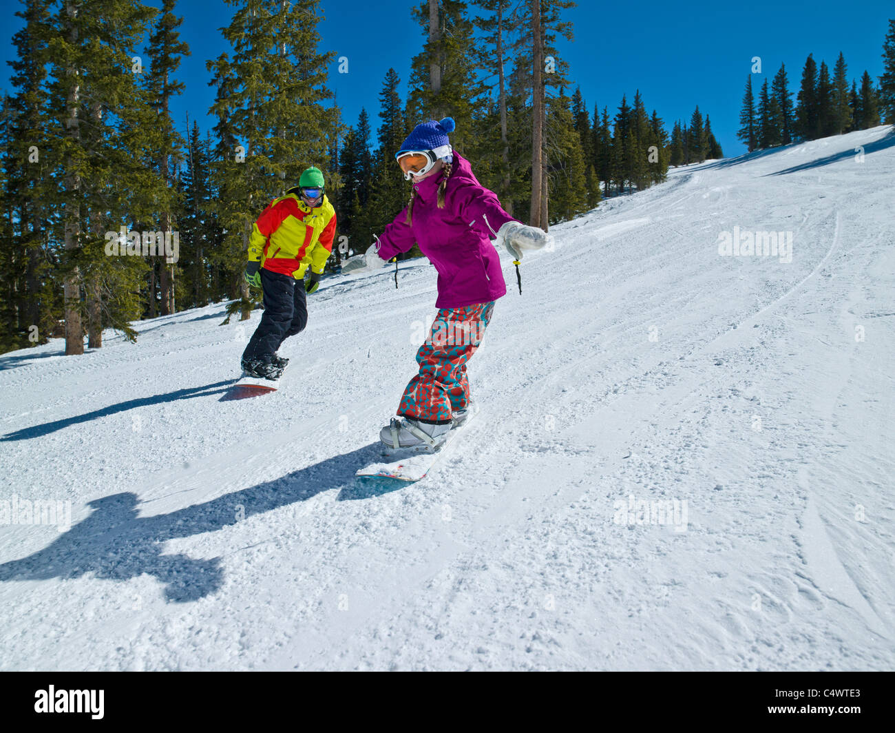 USA,Colorado,Telluride,Father and daughter (10-11) snowboarding Stock ...