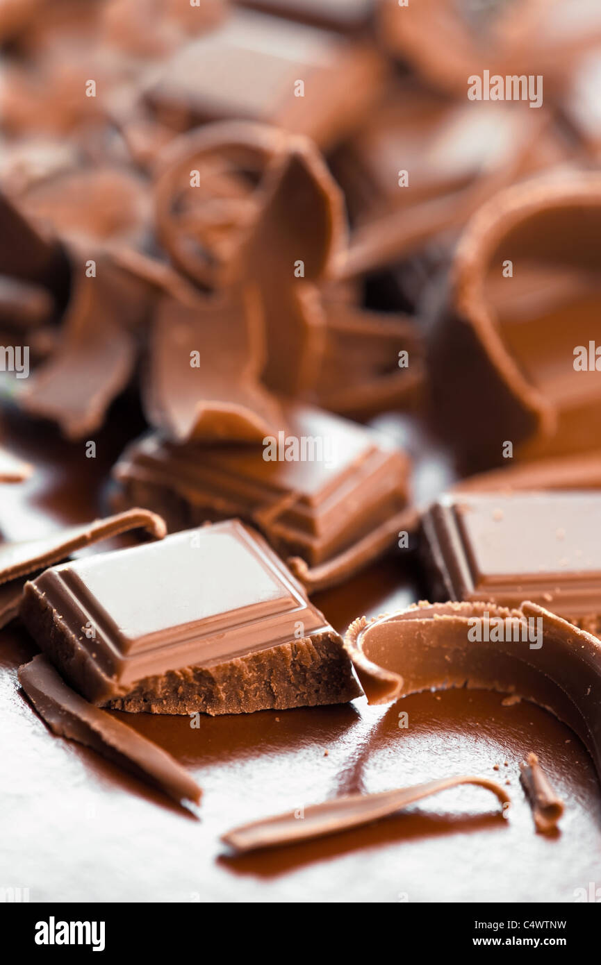 Chocolate background. Bars and strips of chocolate. Shallow depth of ...