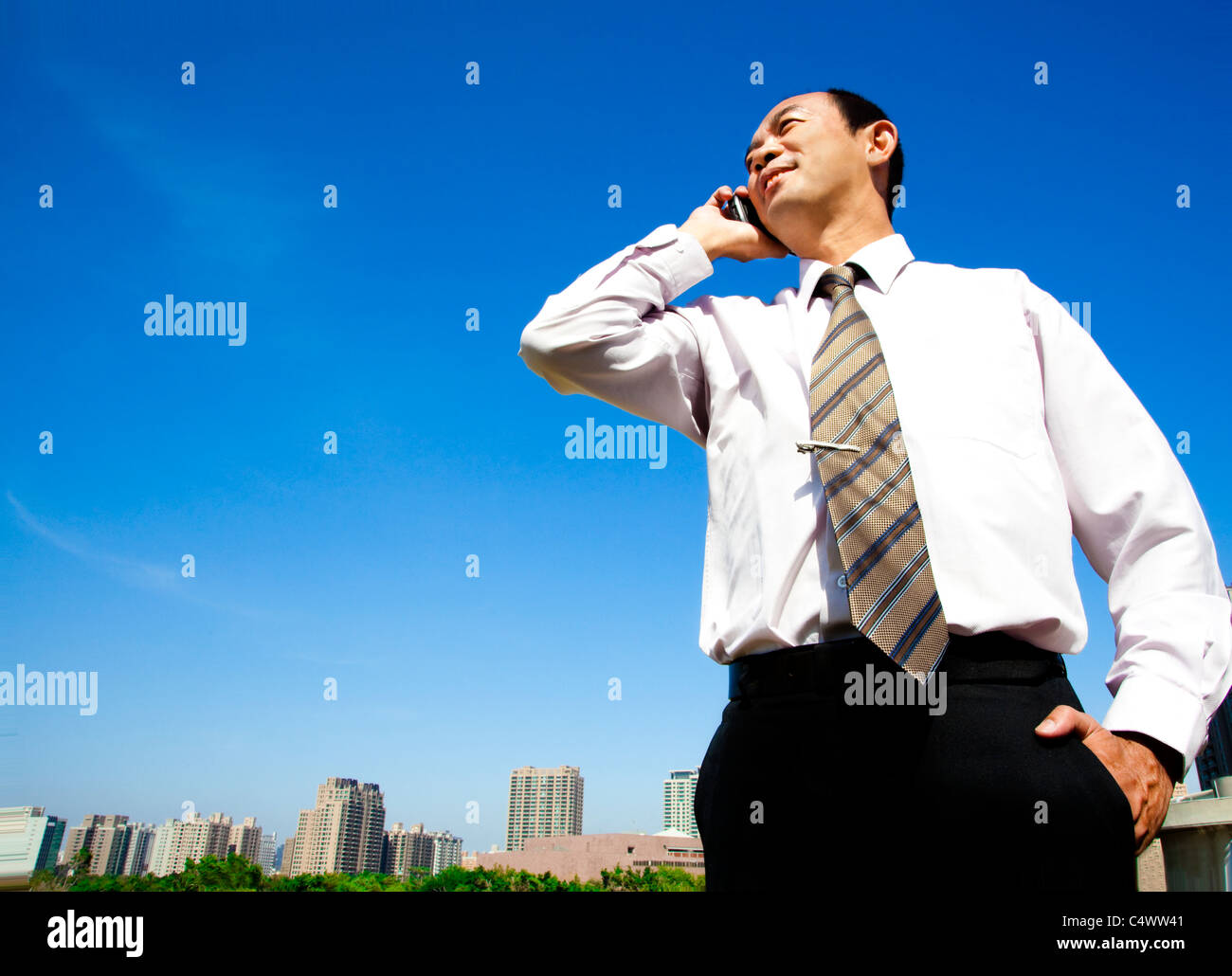 Chinese Businessman On Cell Phone Stock Photo - Alamy