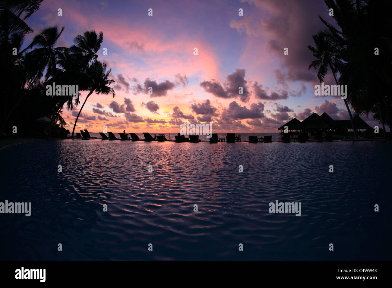 Sunset reflects orange light on a pool of water Stock Photo - Alamy