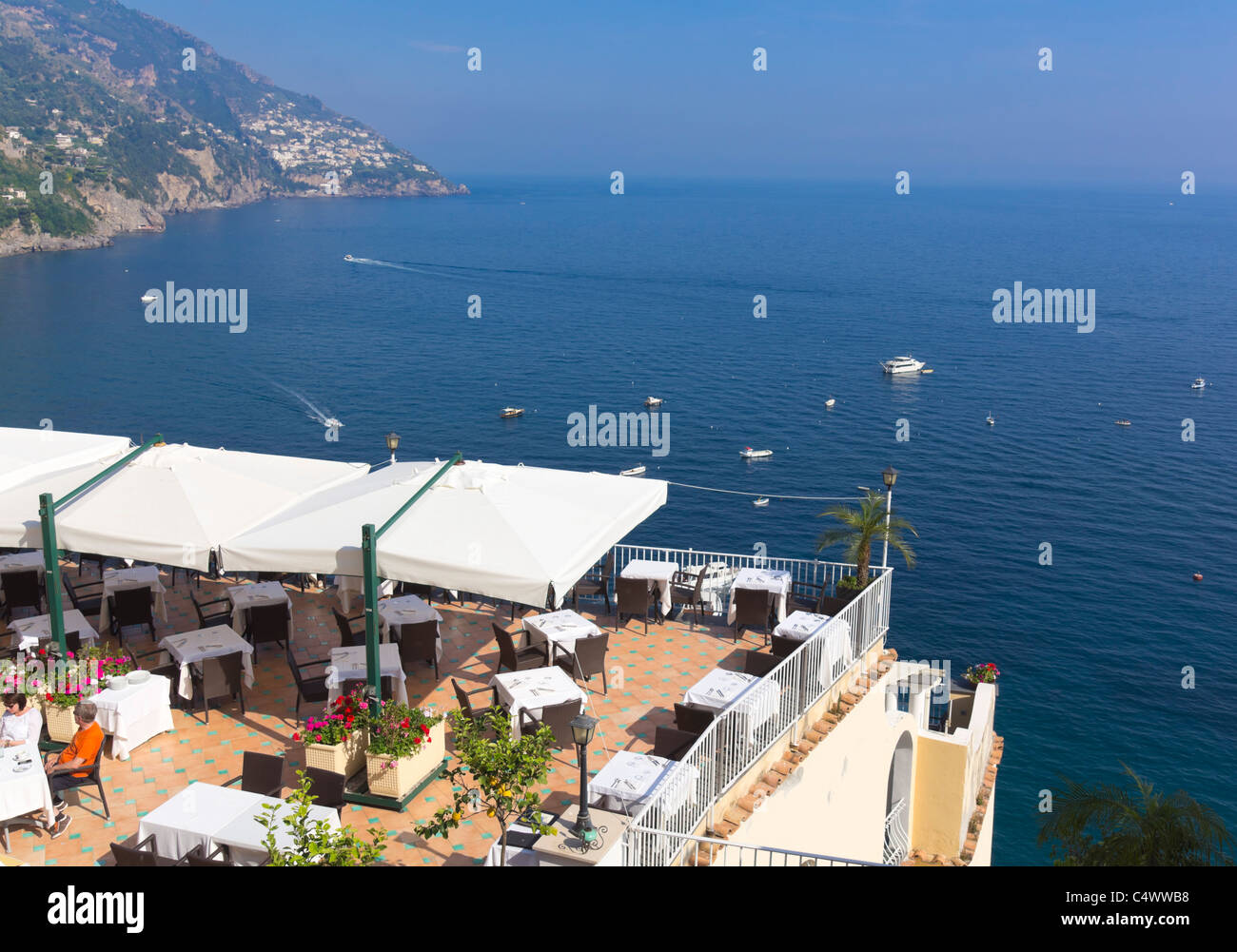 Italy - Positano. Restauranr outdoor seating overlooking the bay Stock ...