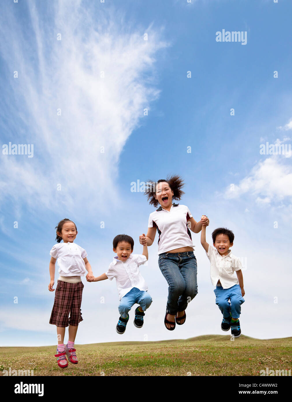 Happy jumping kids hi-res stock photography and images - Alamy
