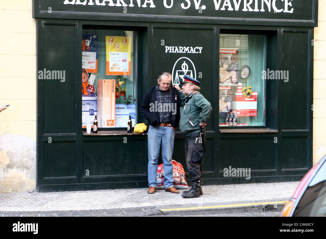 Automn in prag in Czech Republic, people in the street. Two men talking ...