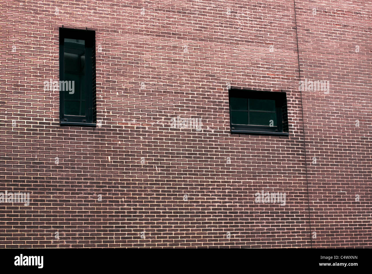 background of wall made from the bricks with two windows Stock Photo ...
