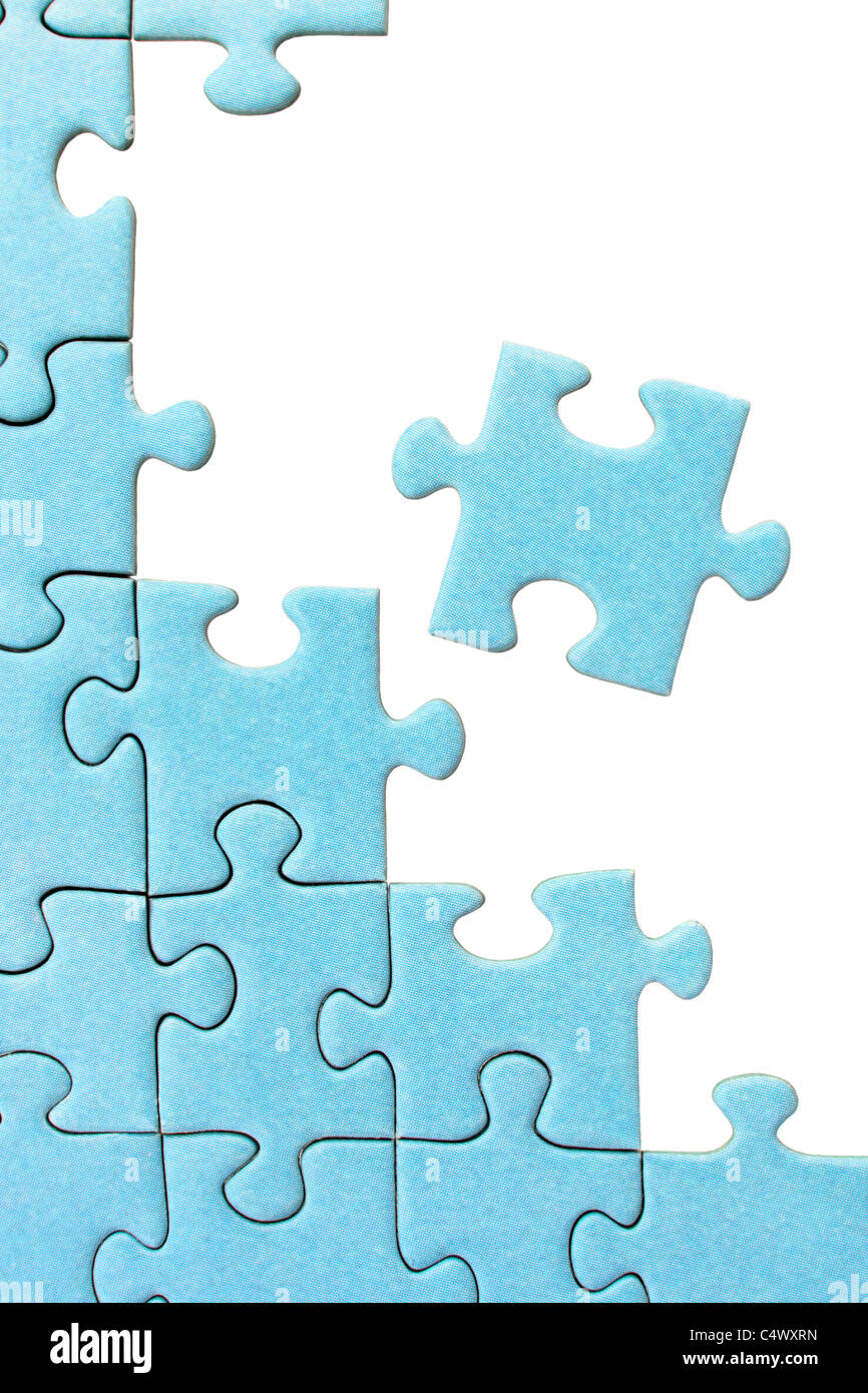 Plain blue jigsaw frame with a single blue piece isolated on the white ...