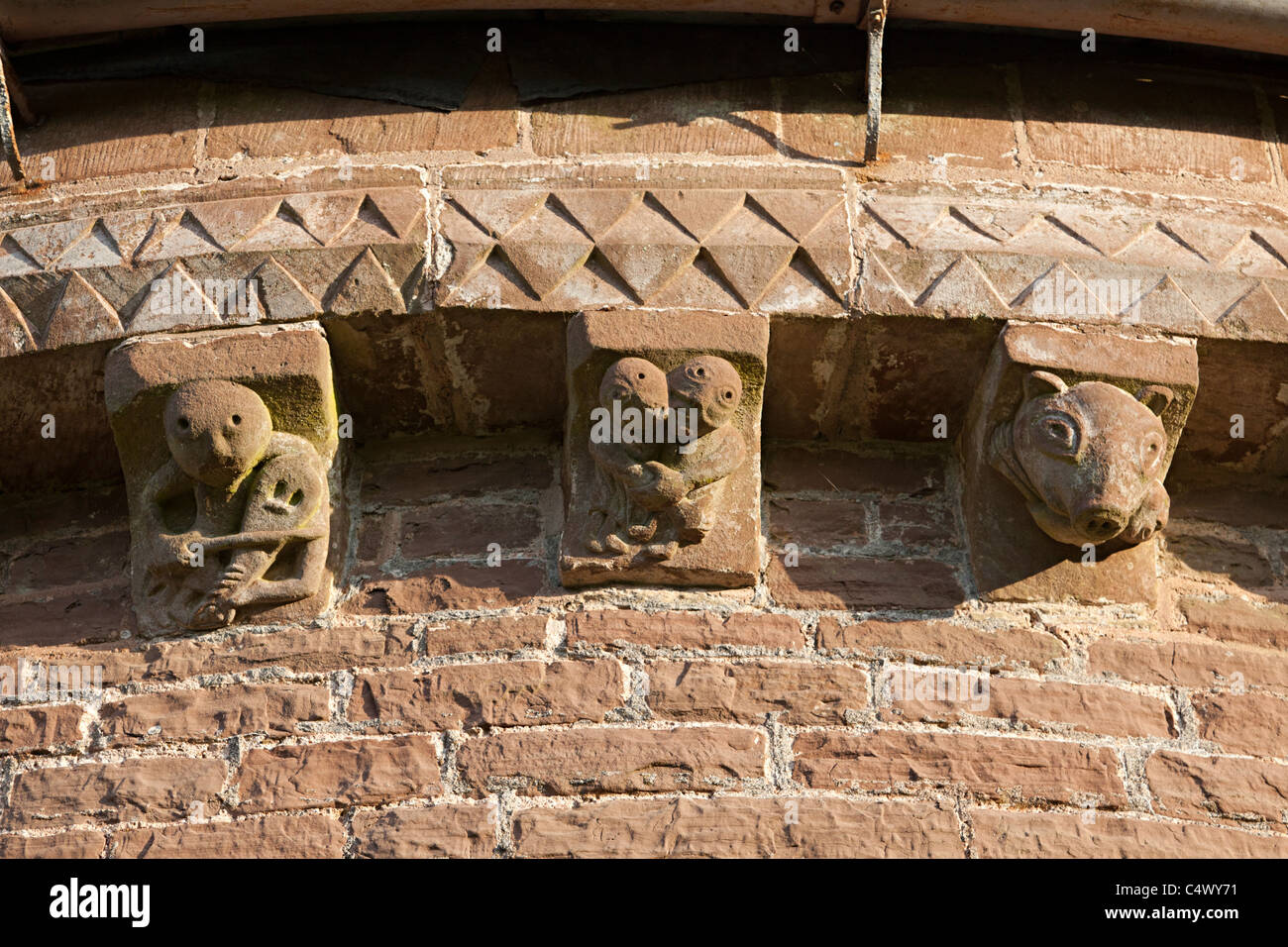 Grotesque corbels on Kilpeck church Herefordshire England UK Stock ...