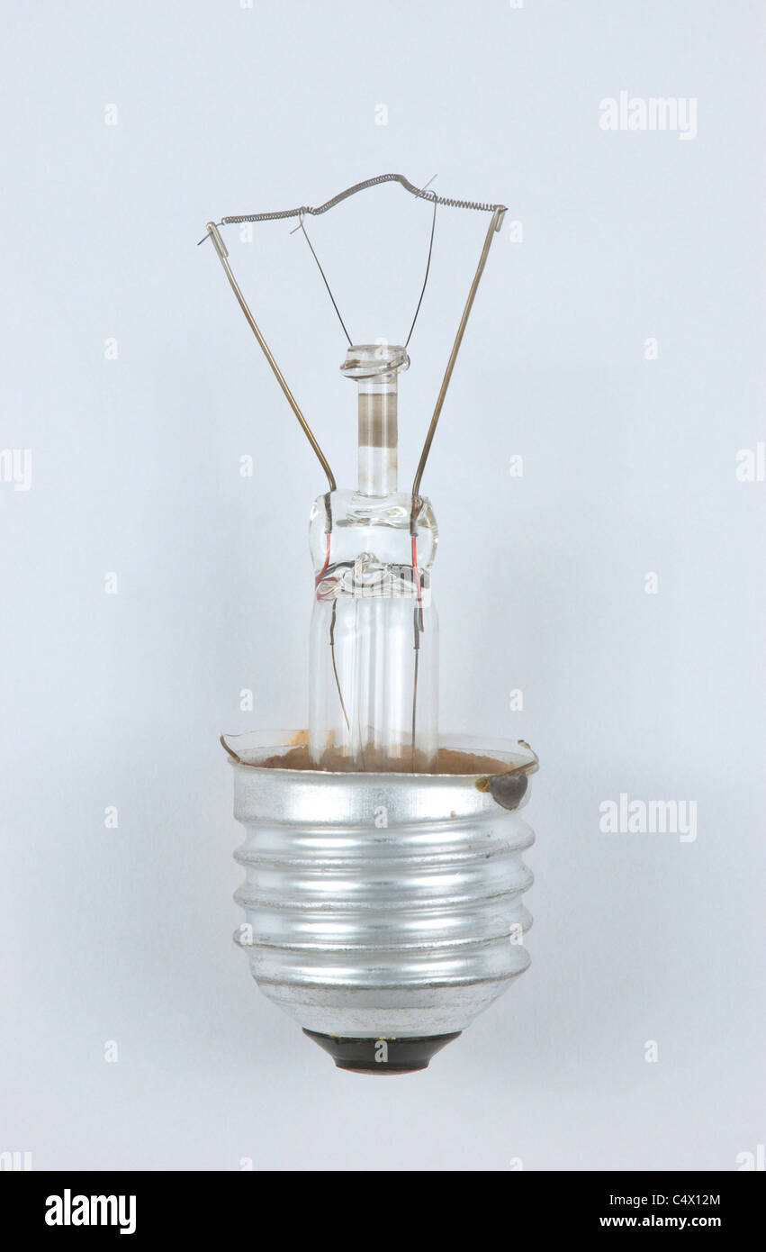 A broken incandescent bulb with the filament intact Stock Photo - Alamy