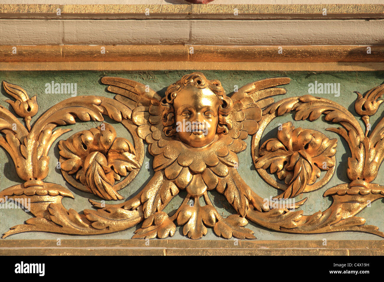 Classic Building Frieze detail cherub Stock Photo - Alamy