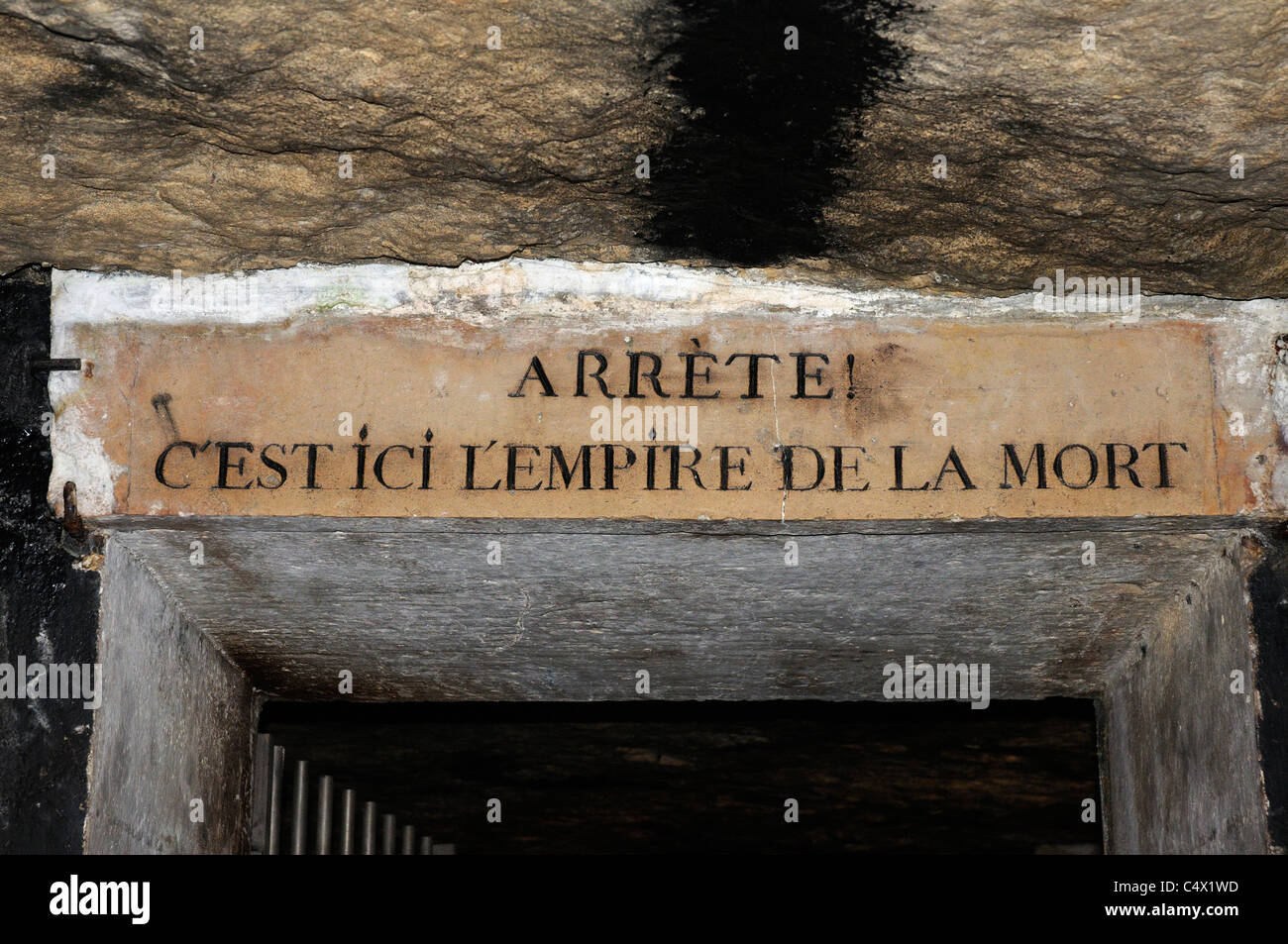 The entrance to the Catacombs of Paris with the legend 'Stop! Here is ...