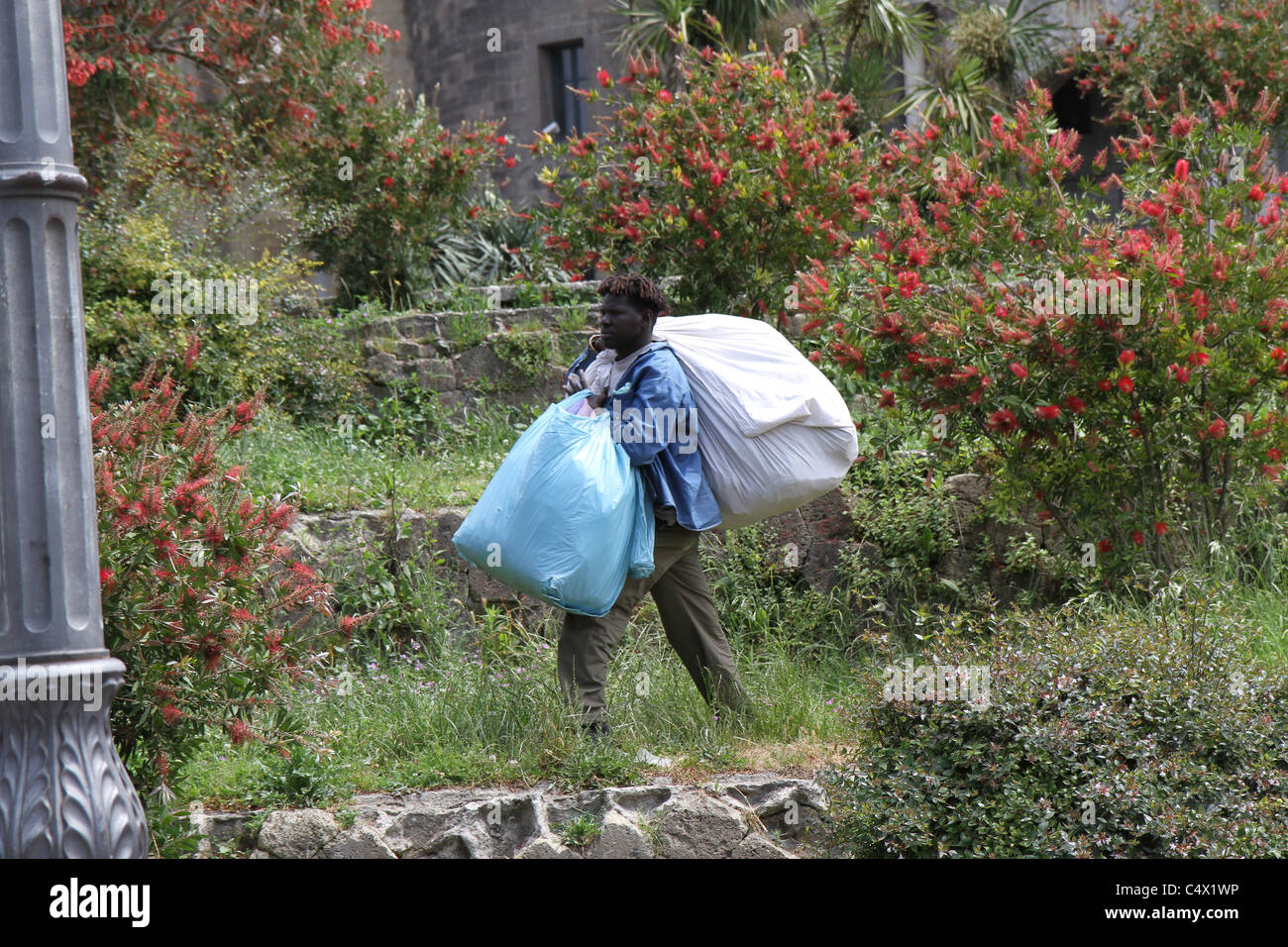 Vendor hiding his illegal and counterfeit products at arrival of the ...