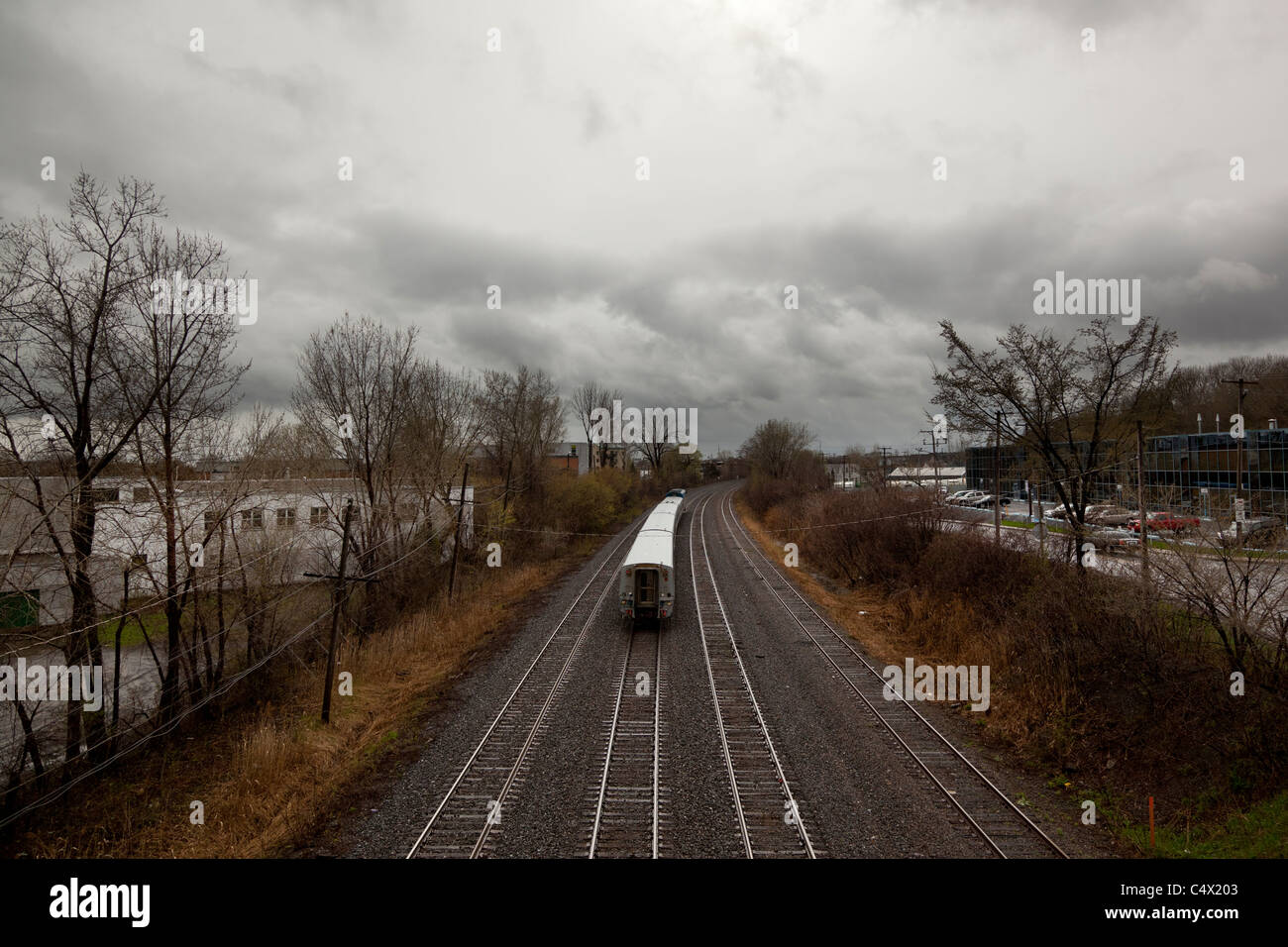 Train passing under overpass in Montreal Stock Photo - Alamy