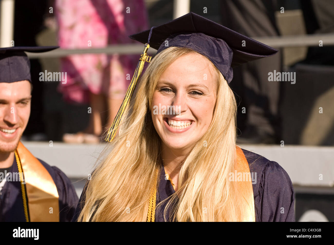 A young woman graduating with her AA degree from Fullerton College ...