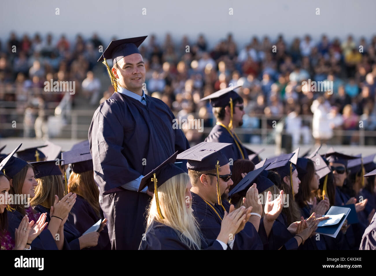 Graduating class black gowns hi-res stock photography and images - Alamy