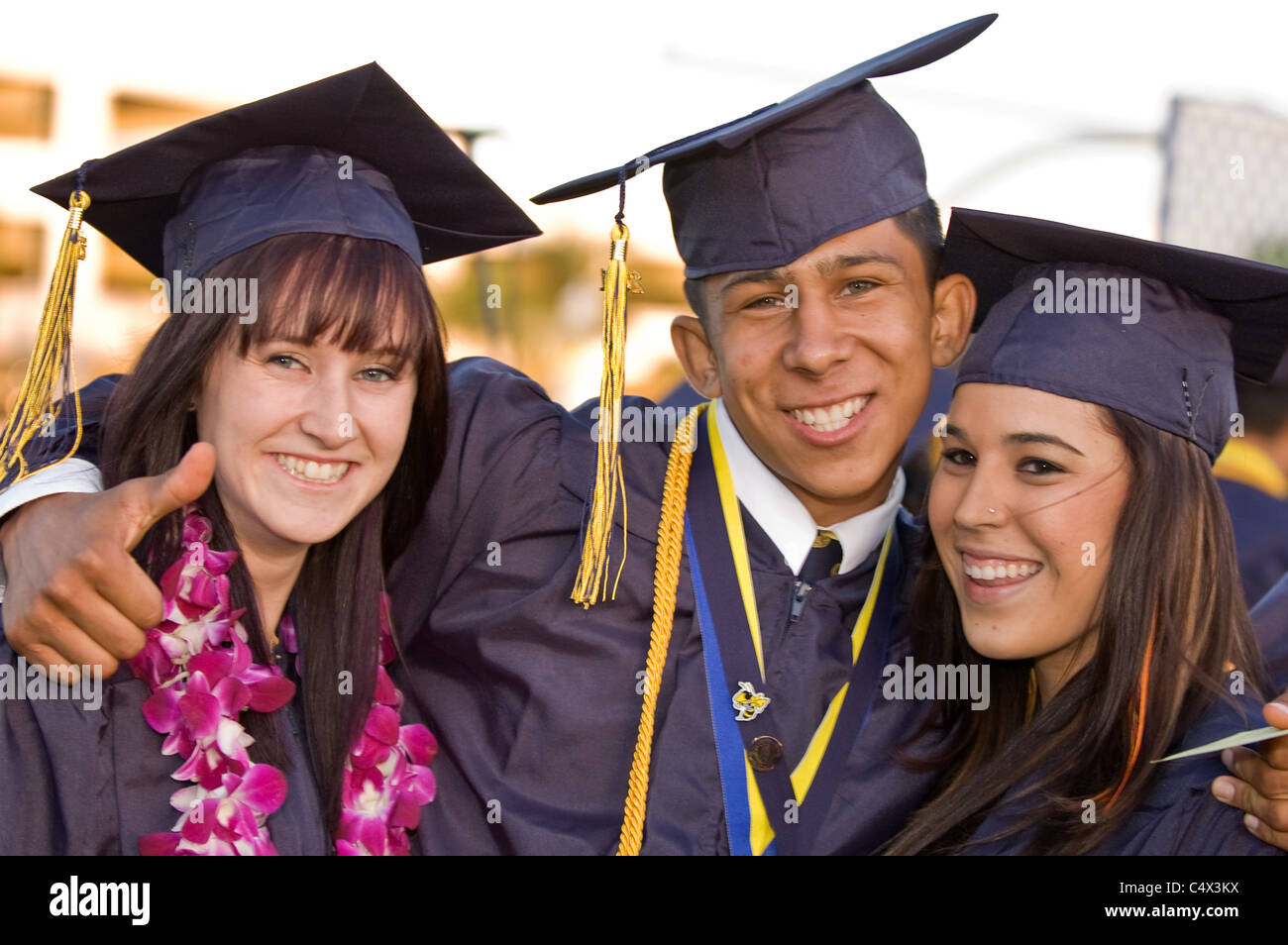 Three young people graduating from Fullerton College, class of 2011 ...