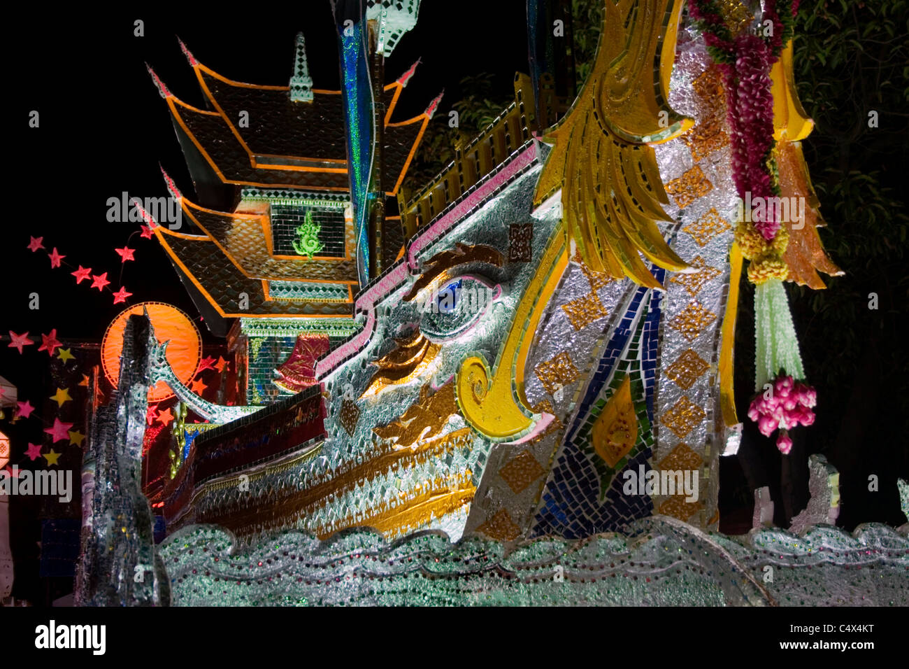 A beautiful and elaborate parade float displays traditional Thai ...