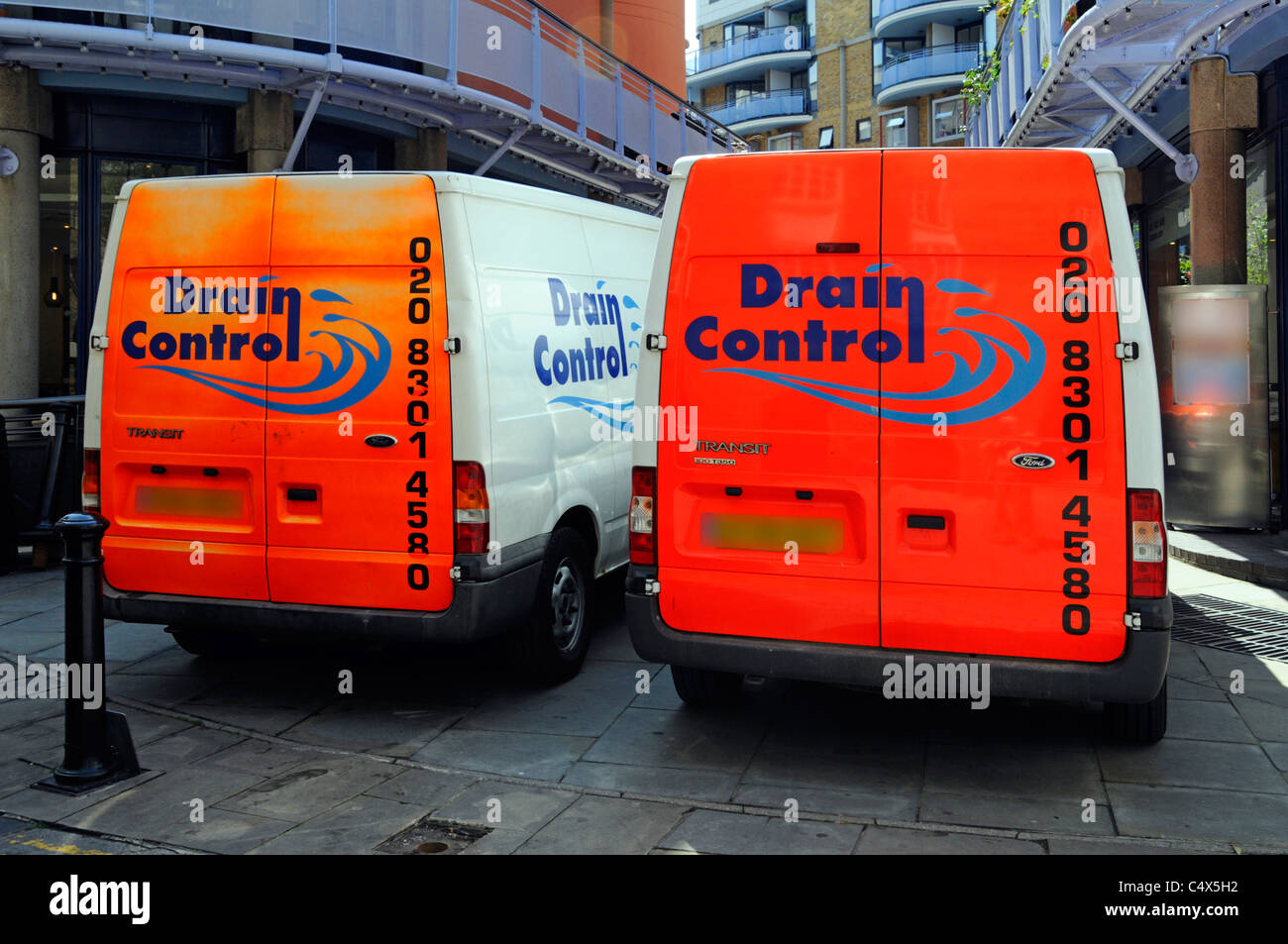 Two of a kind parked "Drain Control" transit vans London England UK ...