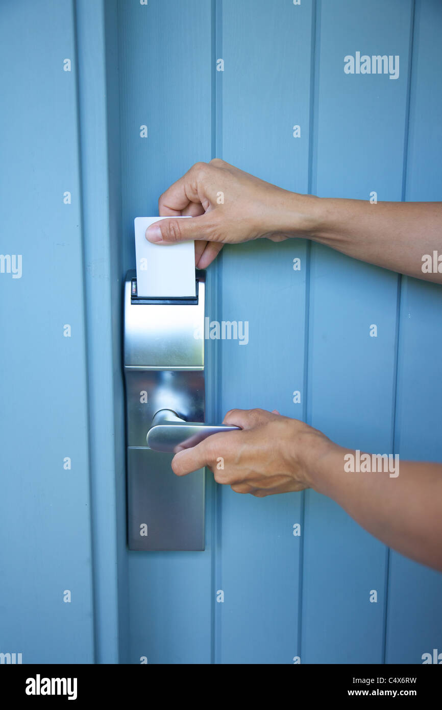 metal lock-card and handle on blue wood door Stock Photo - Alamy