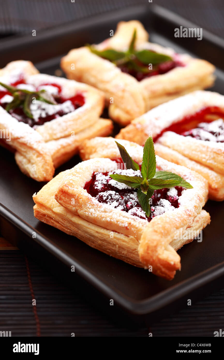 Delicious Cherry puff pastry with powdered sugar Stock Photo - Alamy