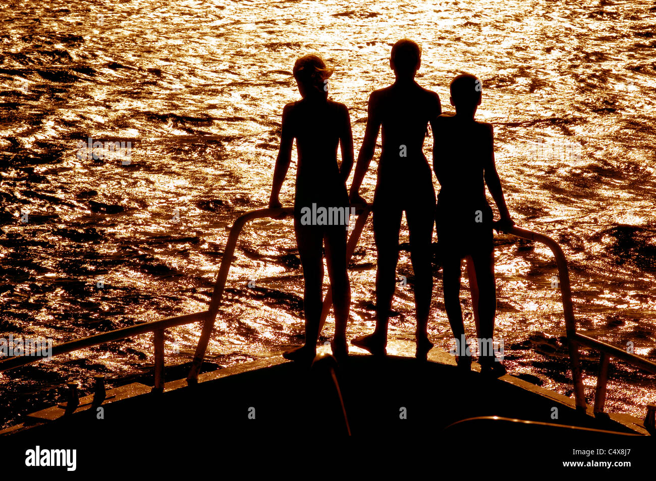 Three kids playing they are like in the "Titanic Stock Photo - Alamy