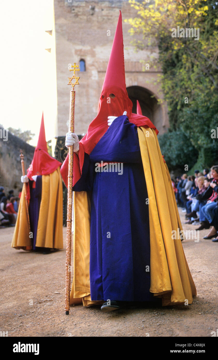 Nazerenos in the procession from the Alhambra during Semana Santa in ...