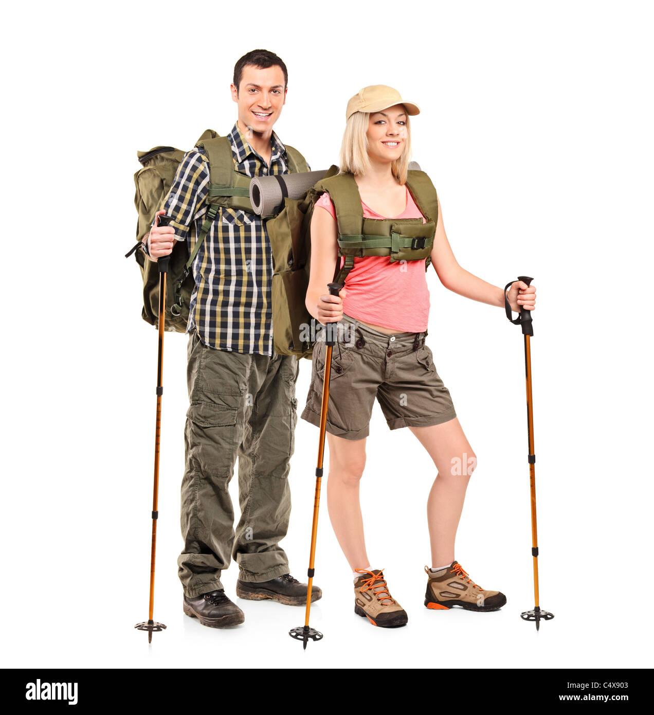 Man and woman in sportswear with backpacks and hiking poles Stock Photo ...
