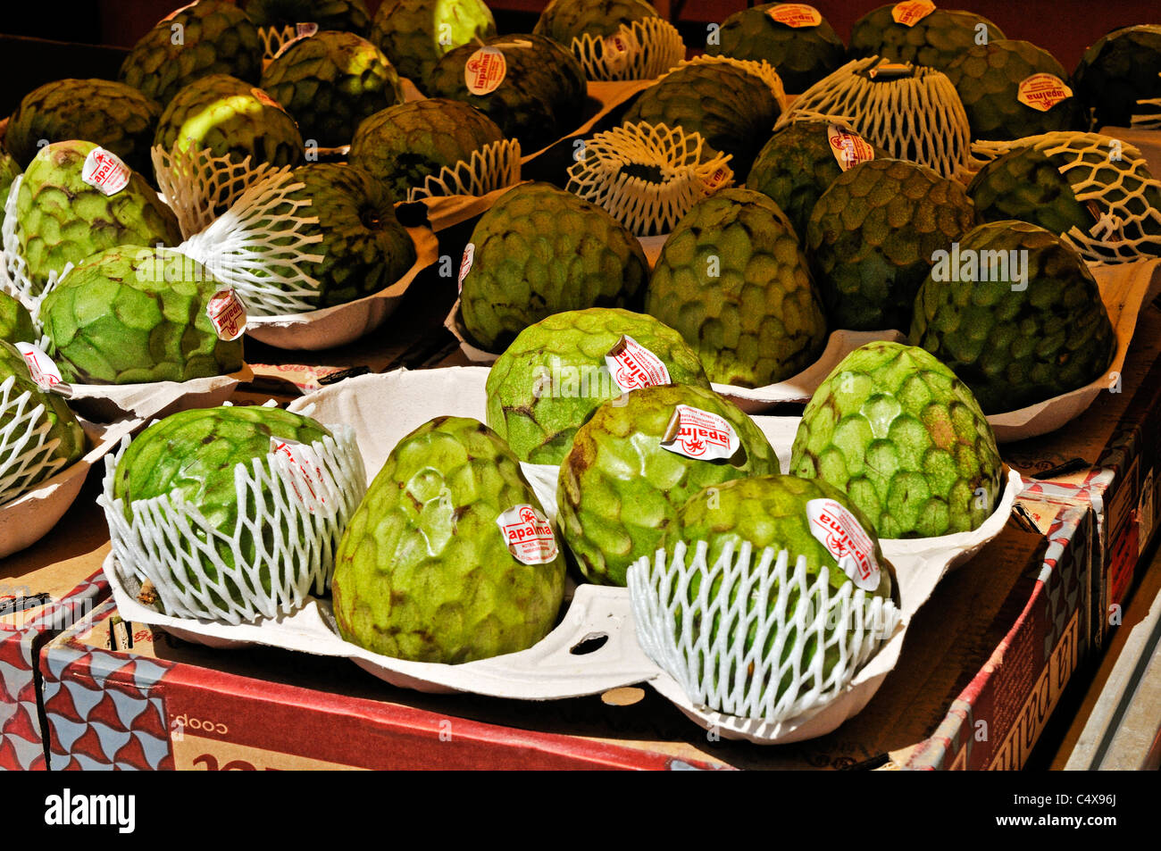 A market stall selling fresh Chirimoyas which are protected from the ...