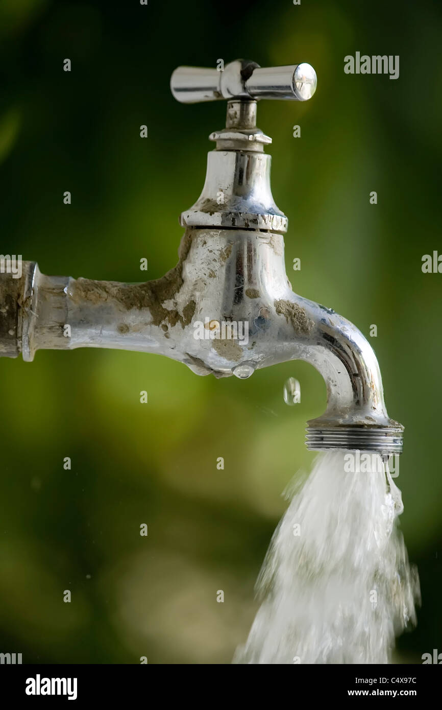 water running from a garden tap Stock Photo - Alamy