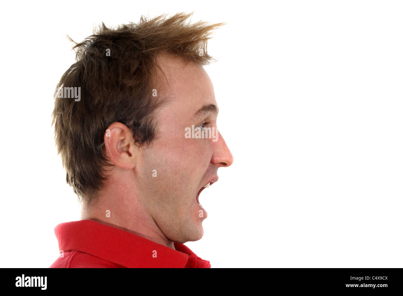 young man screaming with his mouth open Stock Photo - Alamy