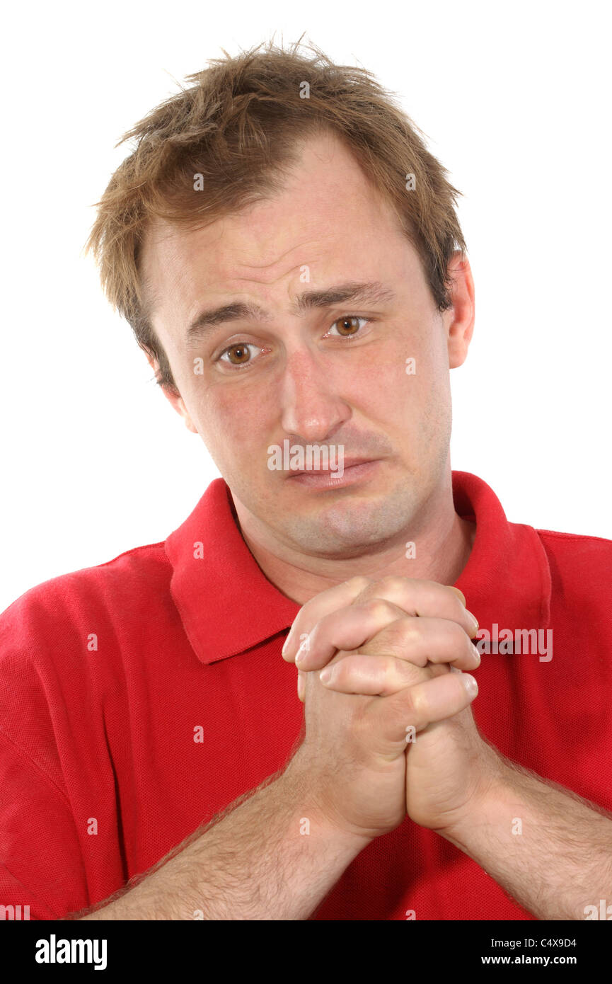 young man with a sad and reverent prayer Stock Photo - Alamy