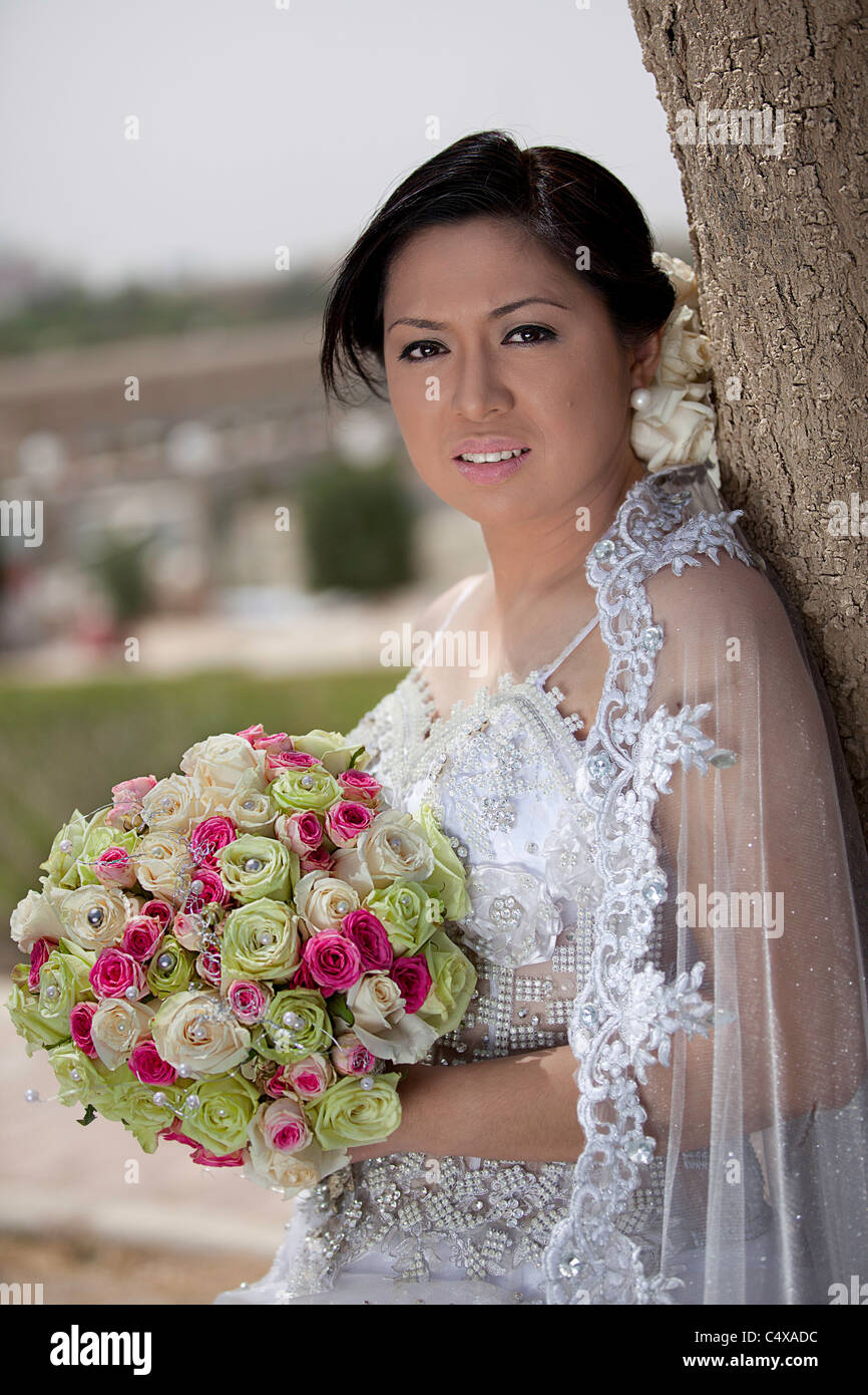 Beautiful woman female bride wedding gown dress white flowers hi-res stock photography and ...