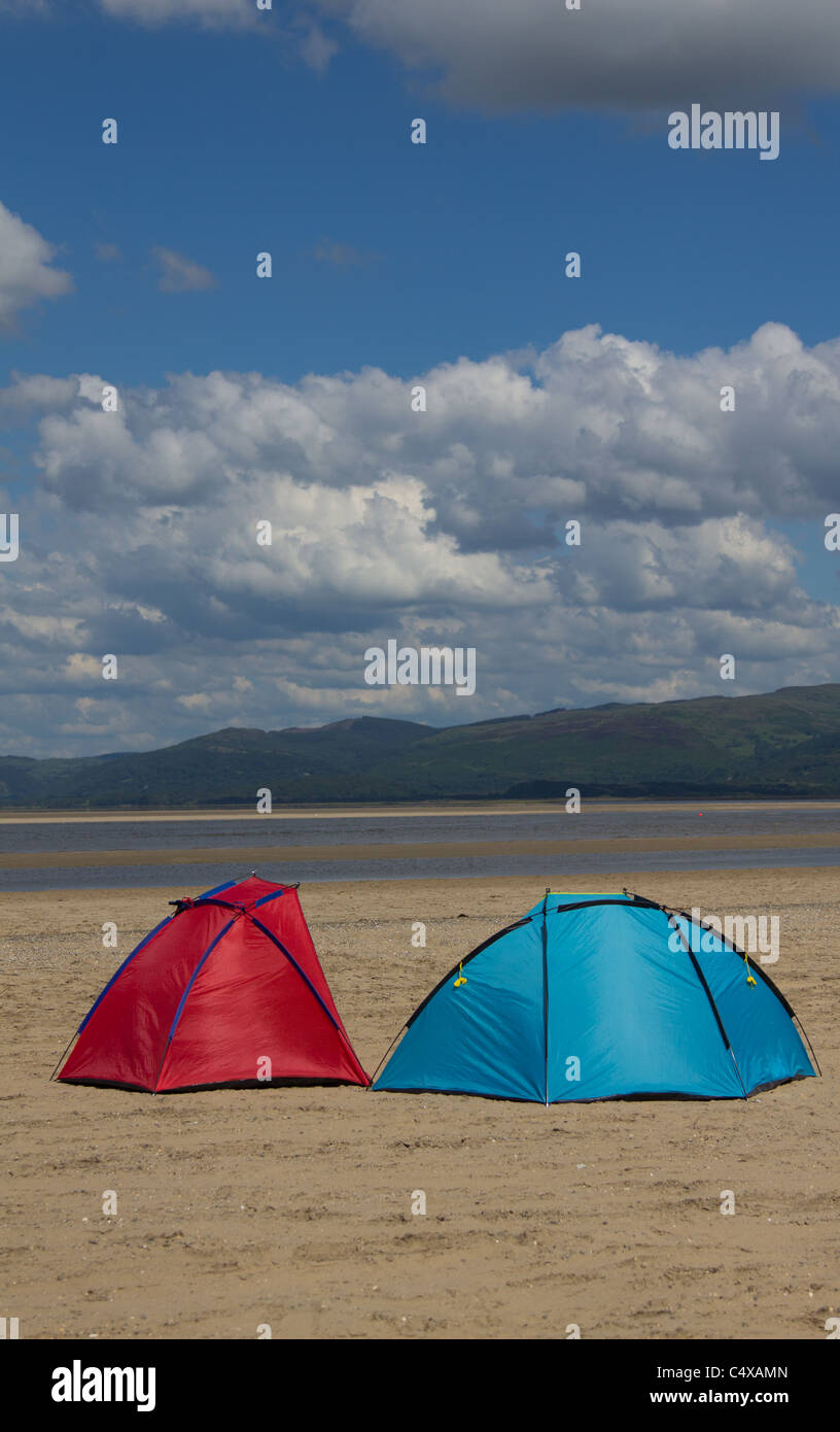 Sun shelters on the beach Stock Photo - Alamy