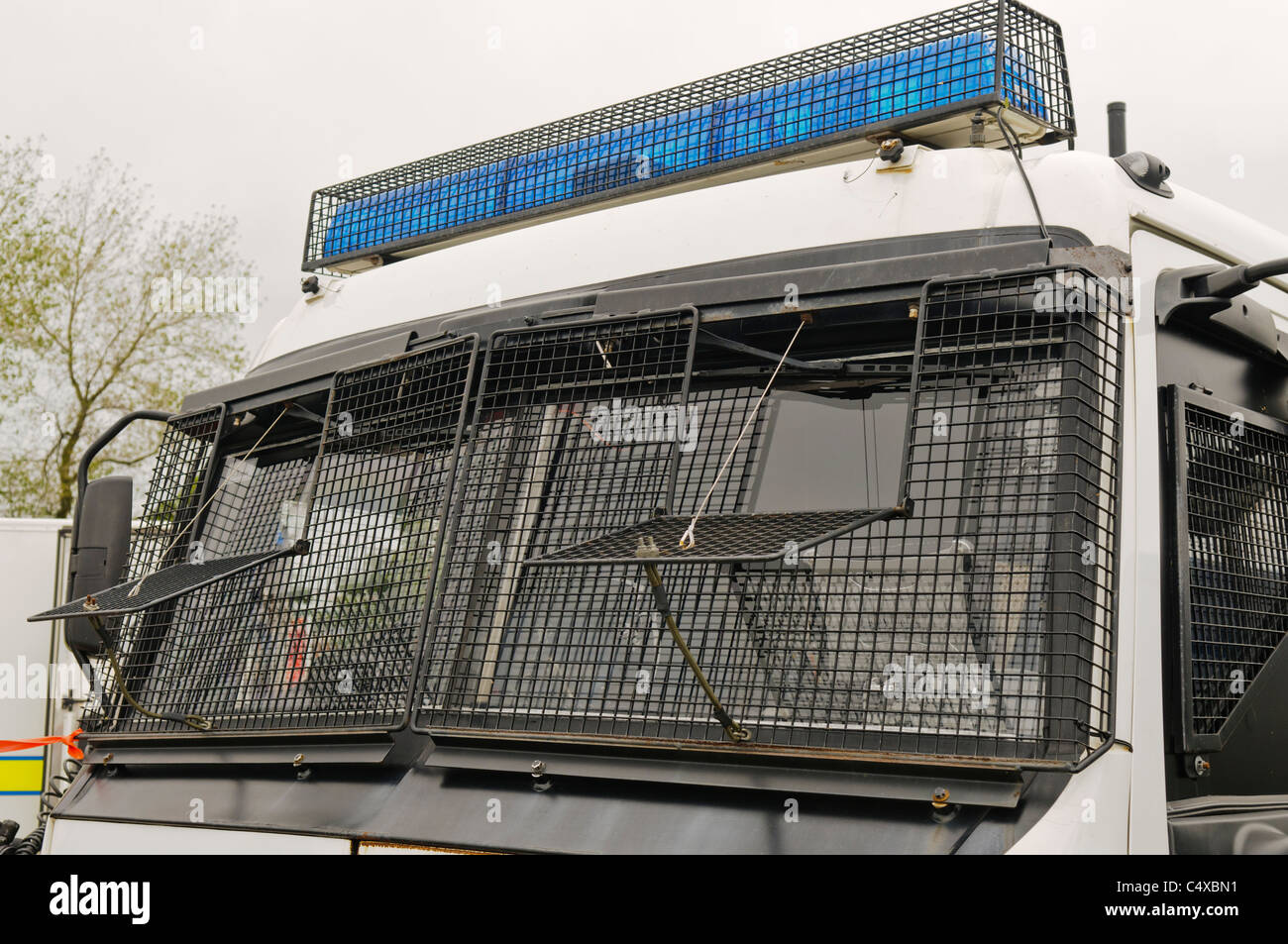 Wire mesh over the front of a military emergency vehicle Stock Photo ...