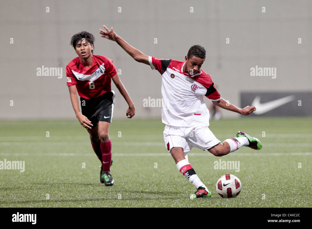 Jorge Marco of CR Flamengo U15(right) takes a shot at goal during the ...