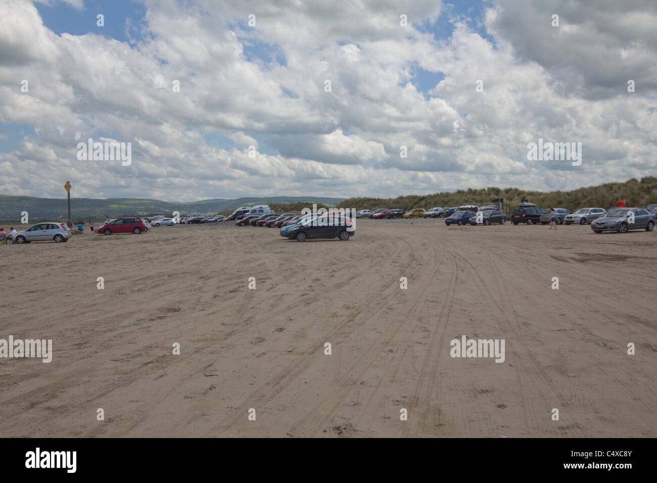 Cars parked on a beach Stock Photo - Alamy