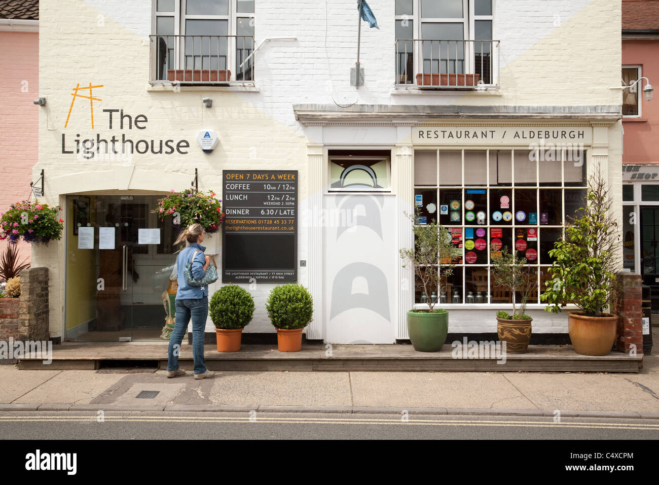 A woman looking at the menu, the Lighthouse restaurant, the High St ...