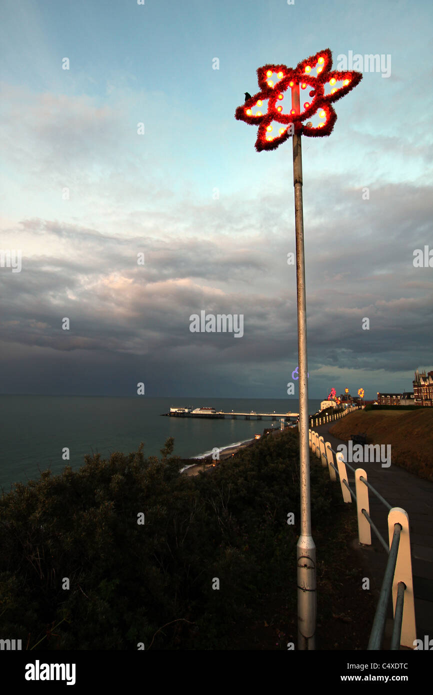 Cromer Pier with storm clouds passing by, taken from the cliff path to ...