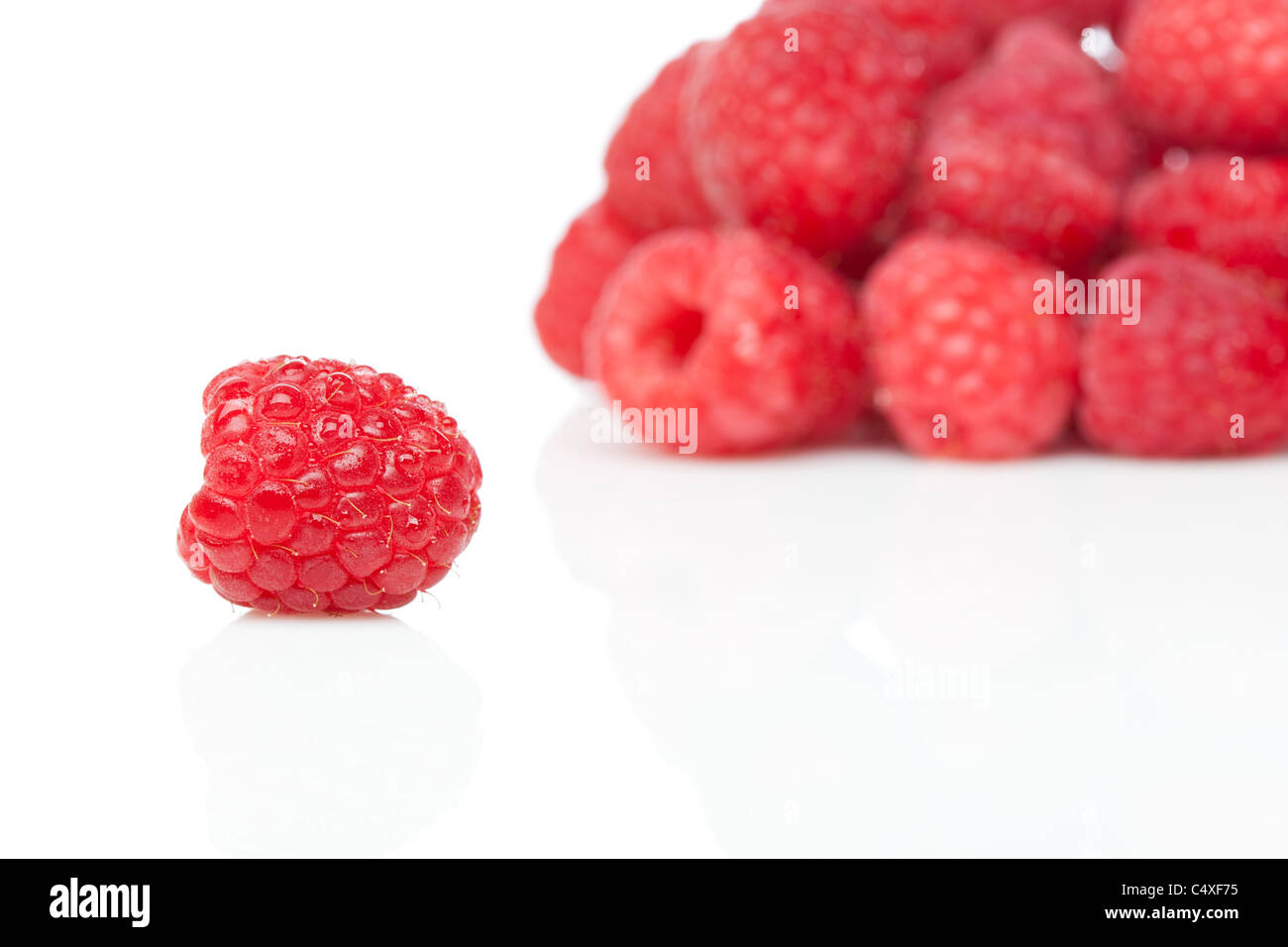Fresh red raspberries against a white background Stock Photo - Alamy