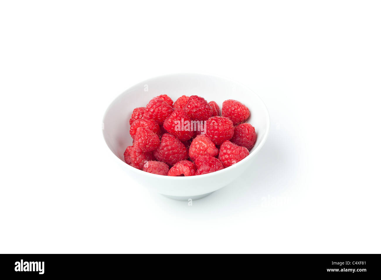 Fresh red raspberries against a white background Stock Photo - Alamy
