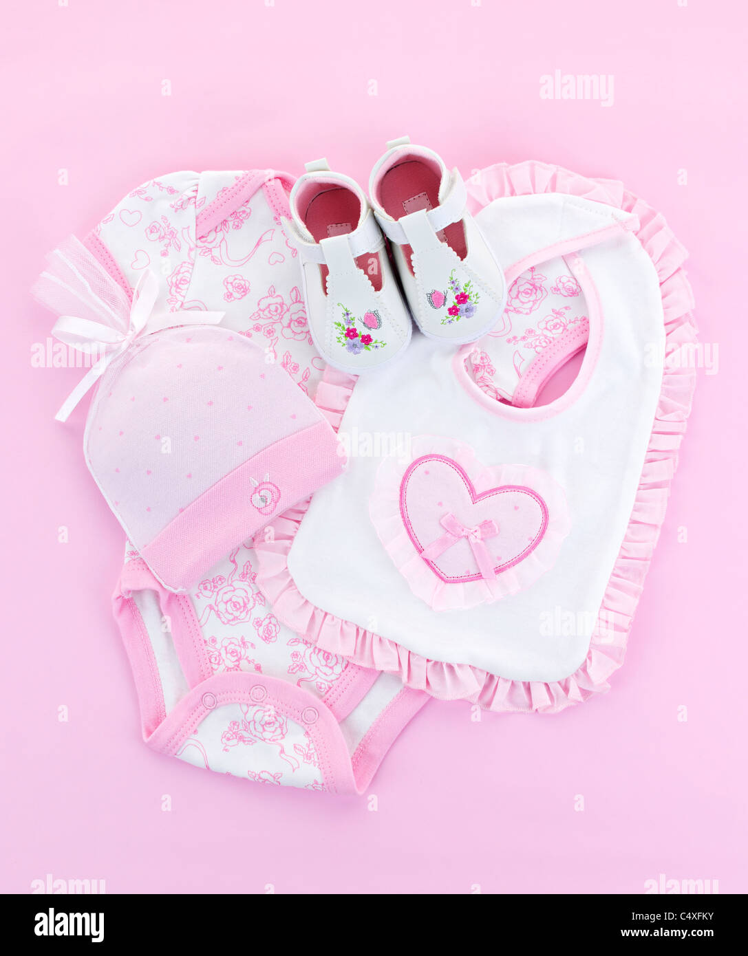 Pink infant girl clothing for baby shower Stock Photo - Alamy